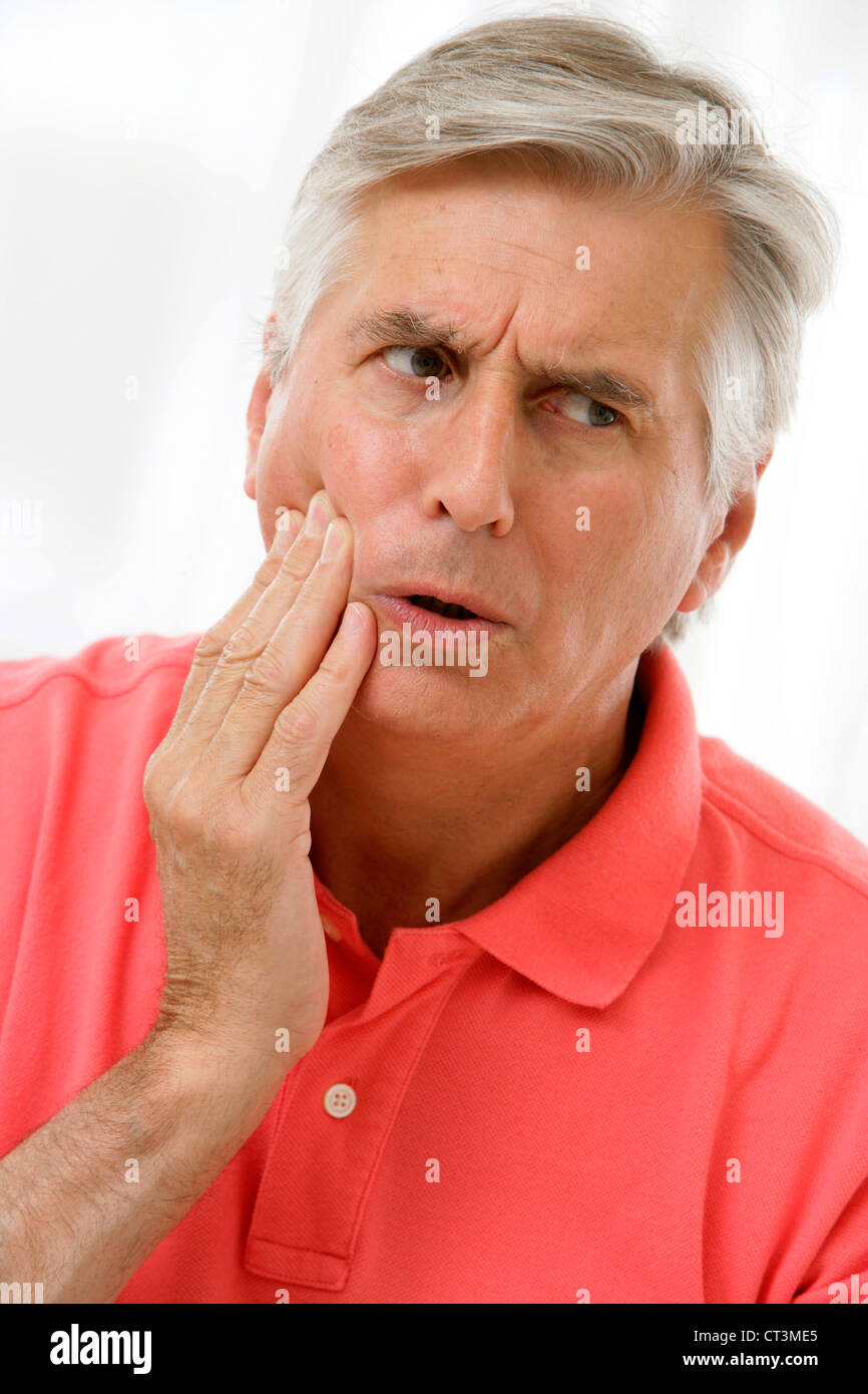 ELDERLY PERSON WITH A TOOTHACHE Stock Photo - Alamy