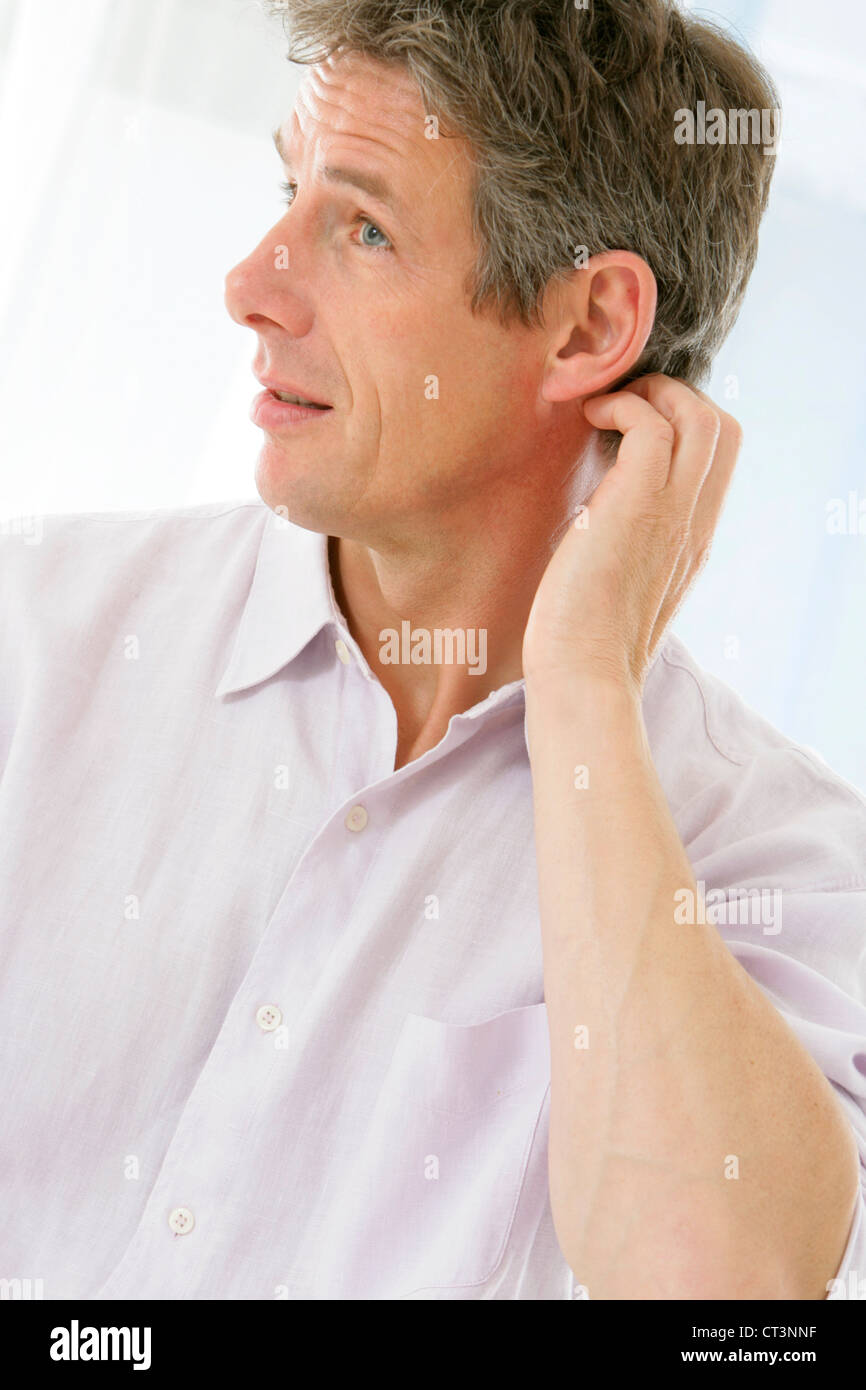 ITCHING IN A MAN Stock Photo - Alamy
