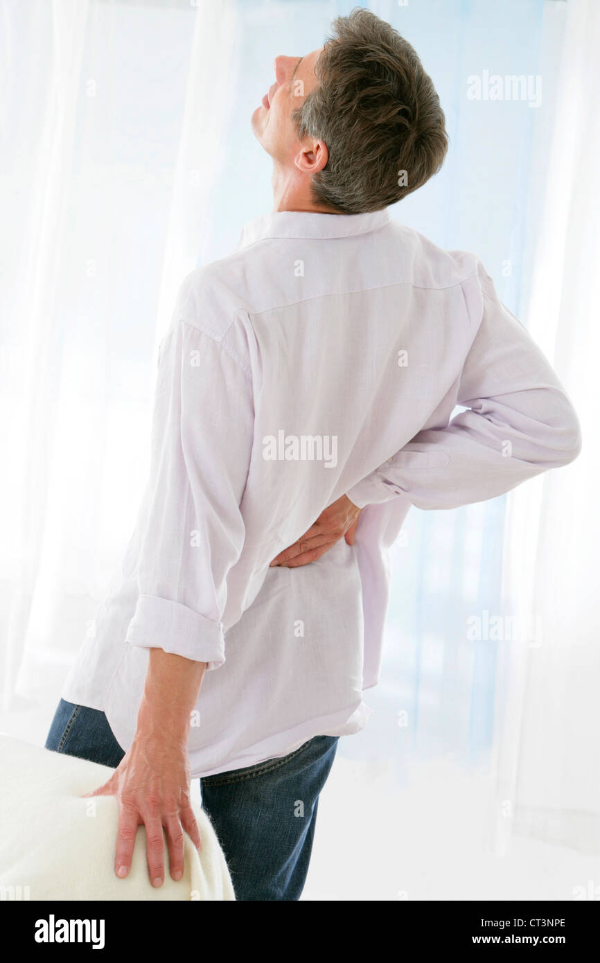 BACK PAIN IN A MAN Stock Photo - Alamy