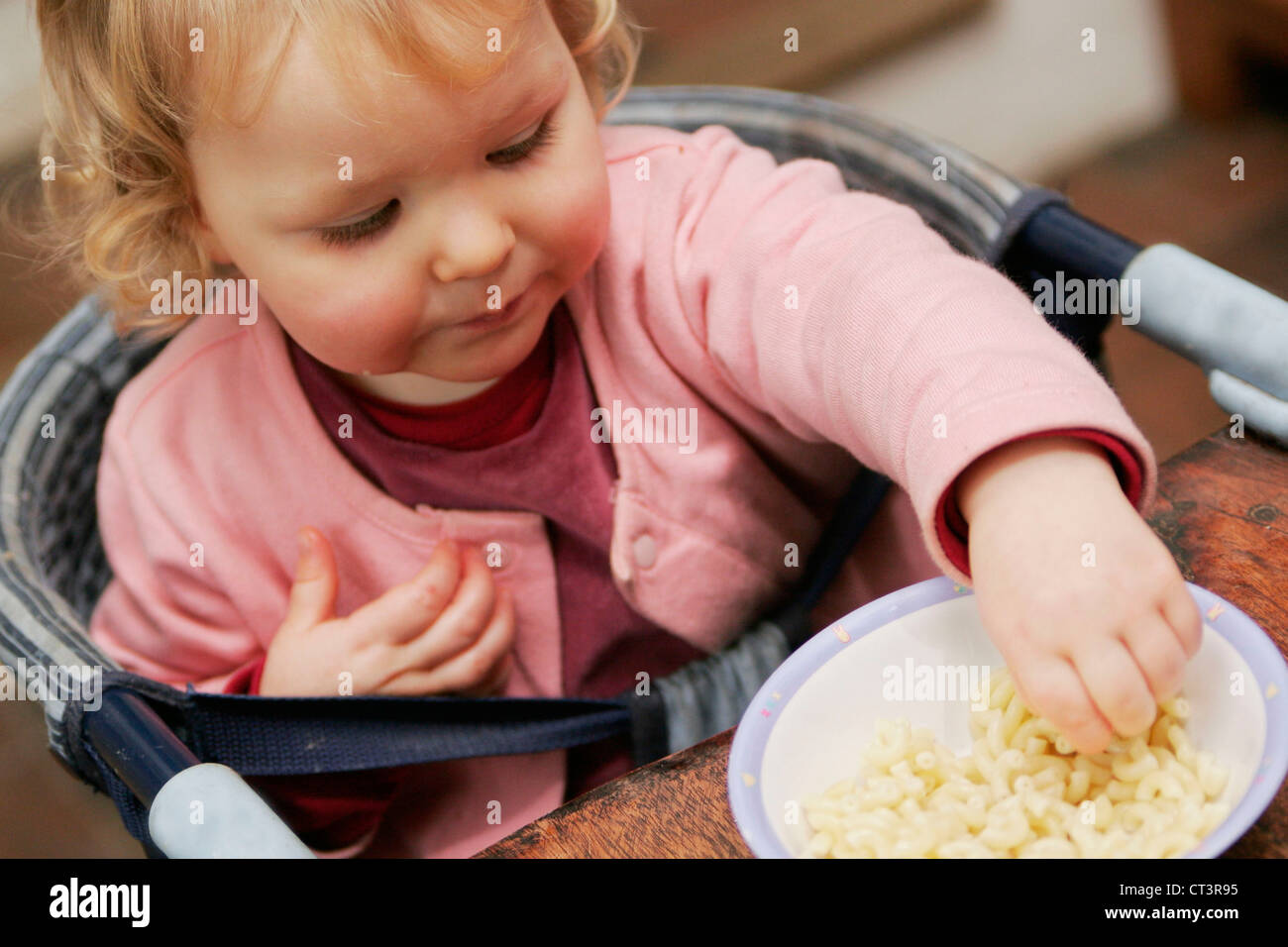 CHILD EATING STARCHY FOOD Stock Photo - Alamy