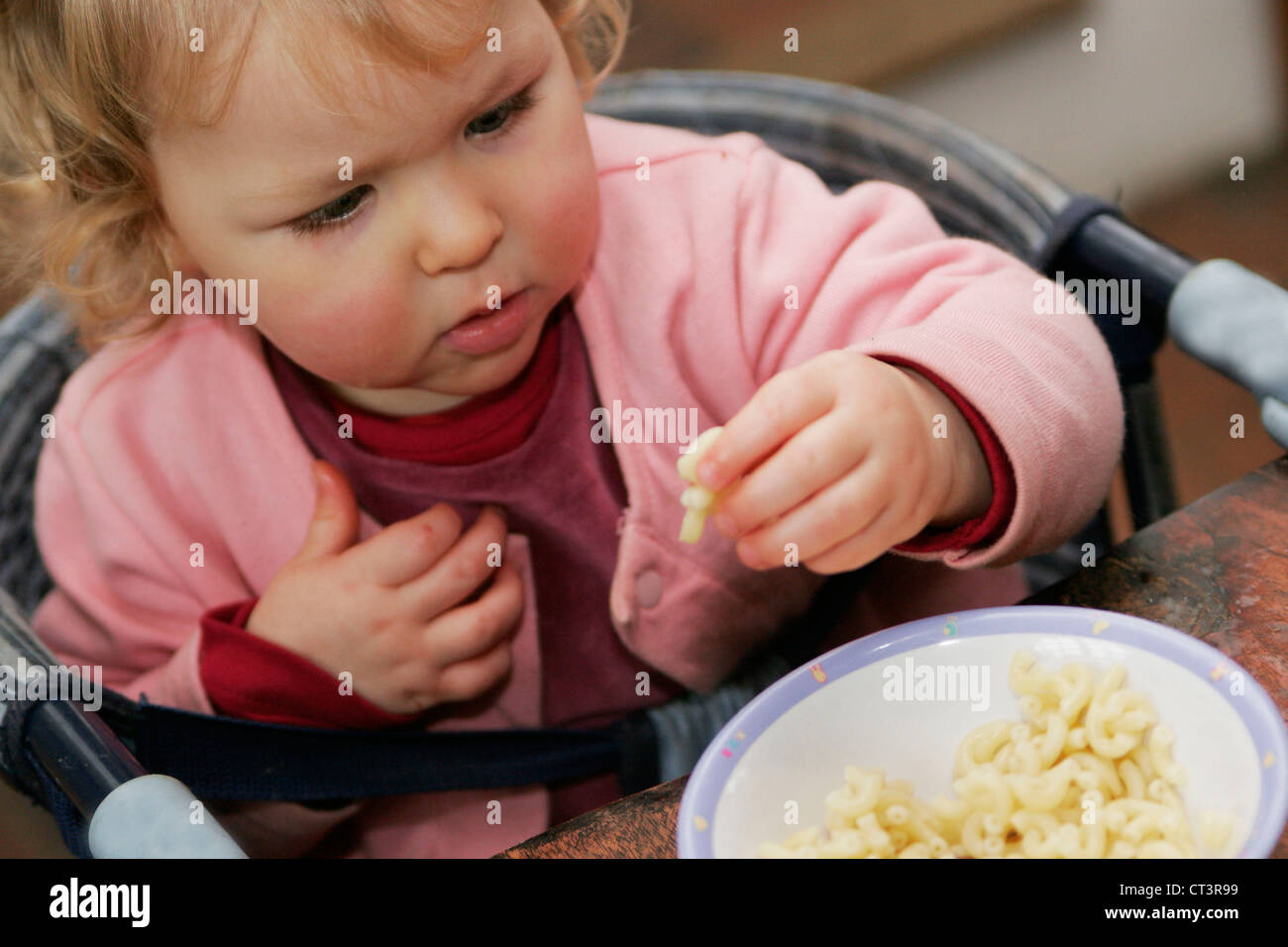 CHILD EATING STARCHY FOOD Stock Photo - Alamy