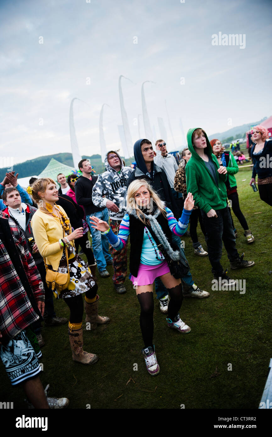 People dancing outdoors in the rain at The Rare One music dance party ...
