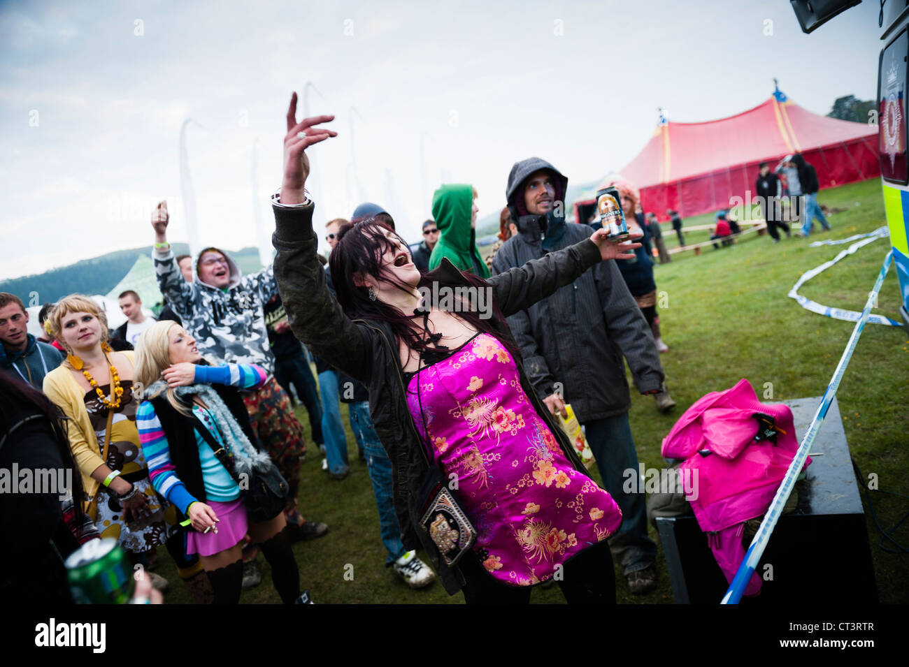 People dancing outdoors in the rain at The Rare One music dance party ...