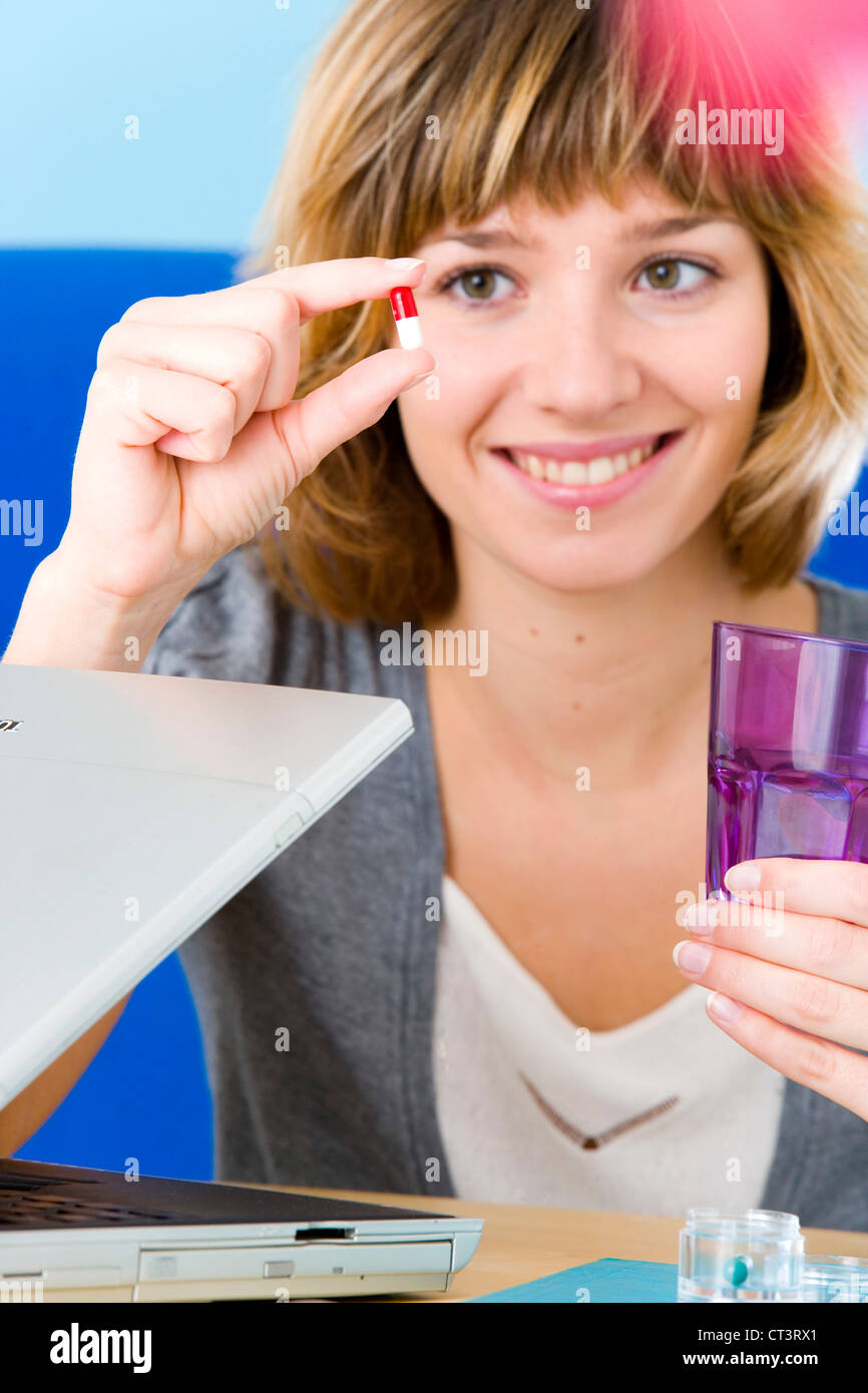 WOMAN TAKING MEDICATION Stock Photo - Alamy