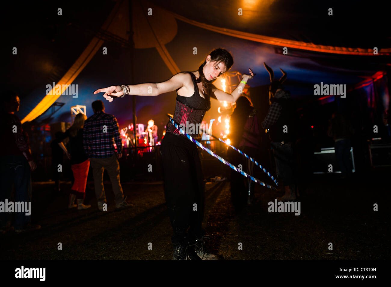 A woman dancing with a hoola hoop at The Rare One music dance party ...