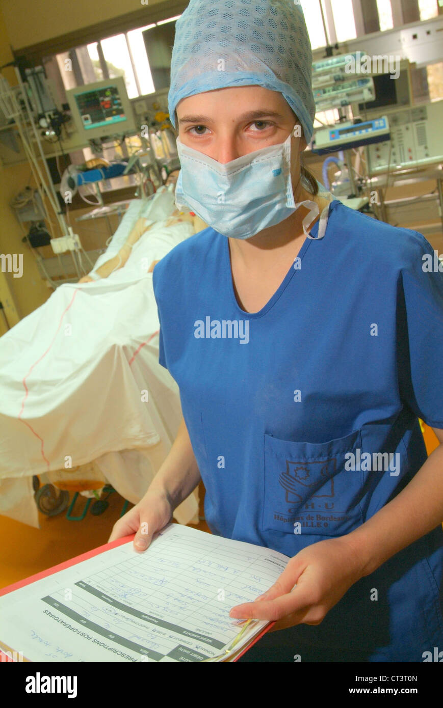NURSE WITH PATIENT'S RECORD Stock Photo - Alamy
