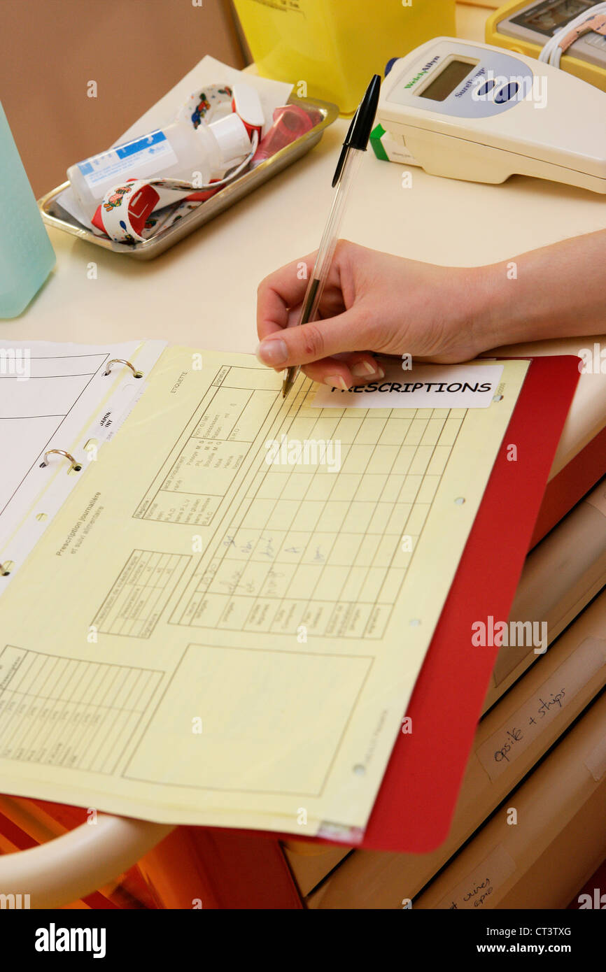 NURSE WITH PATIENT'S RECORD Stock Photo - Alamy