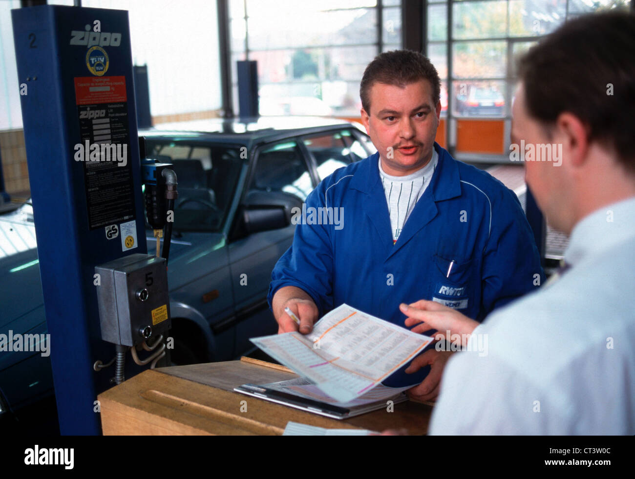 TUV, car main investigation Stock Photo - Alamy