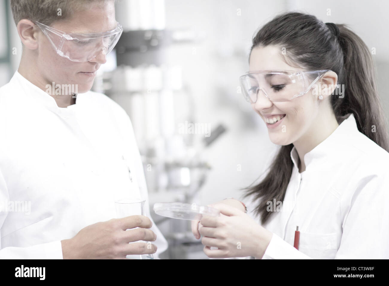 Scientists working in lab Stock Photo - Alamy