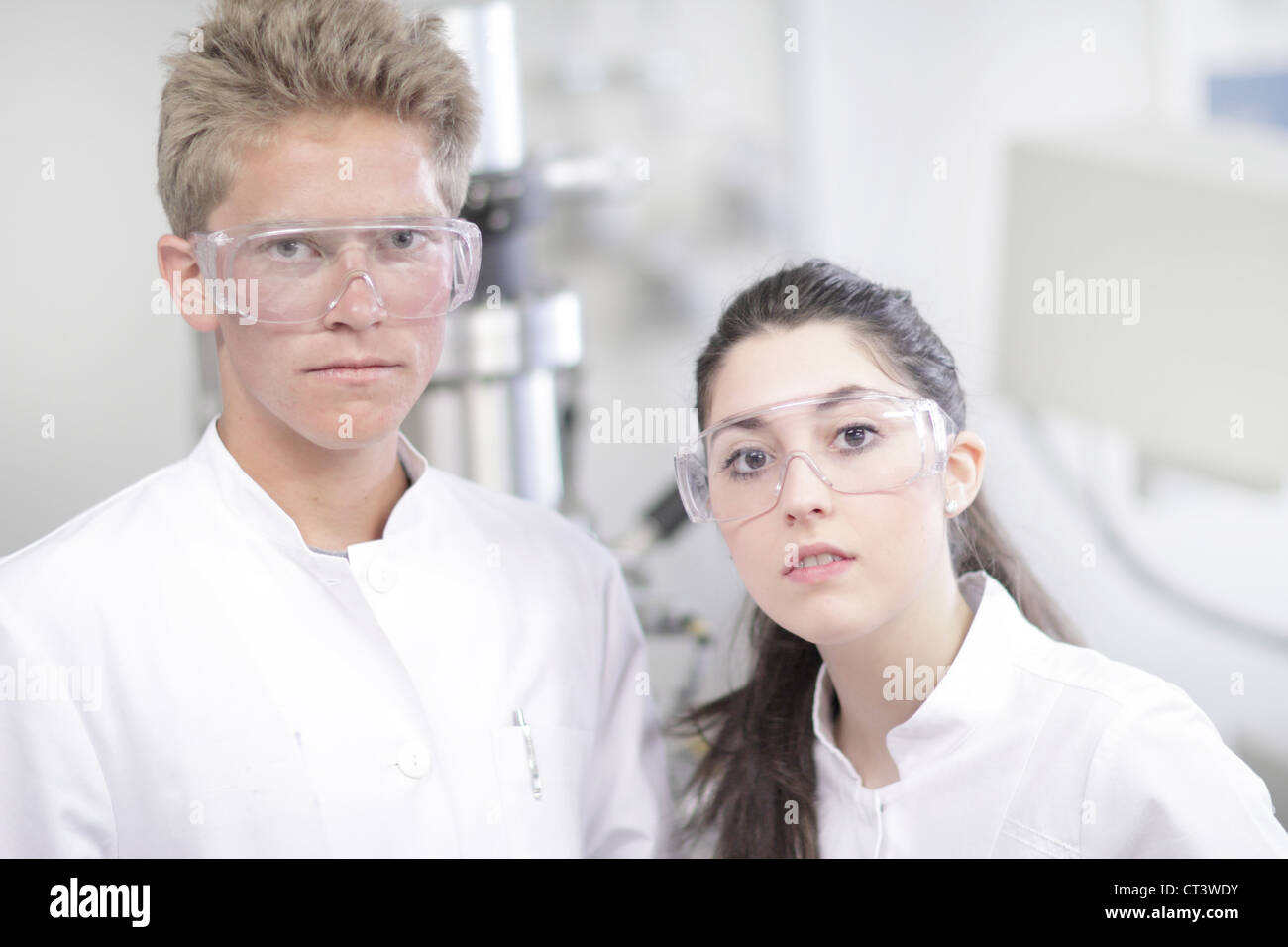 Scientists wearing goggles in lab Stock Photo - Alamy