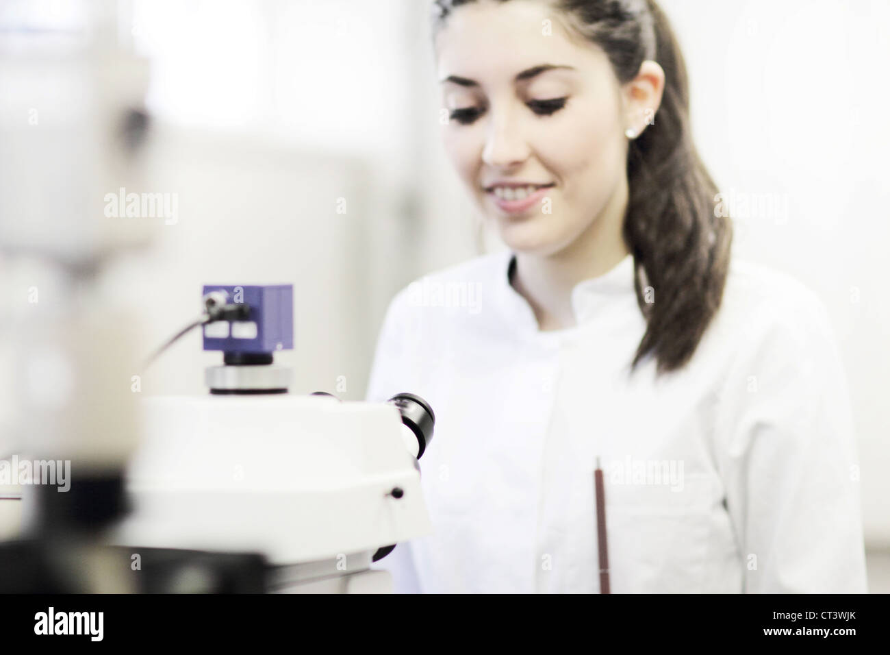 Scientist using microscope in lab Stock Photo - Alamy