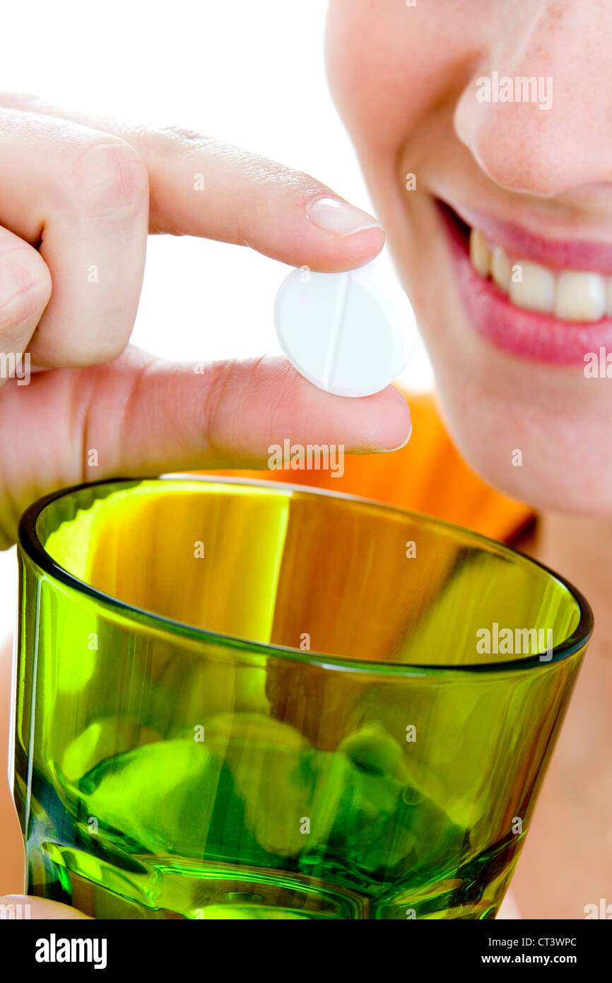 WOMAN TAKING MEDICATION Stock Photo - Alamy