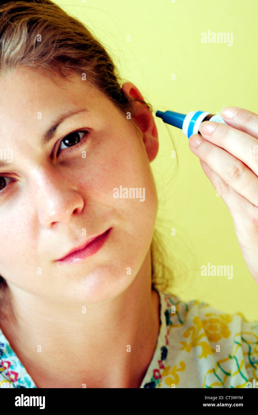 EAR TREATMENT, WOMAN Stock Photo - Alamy