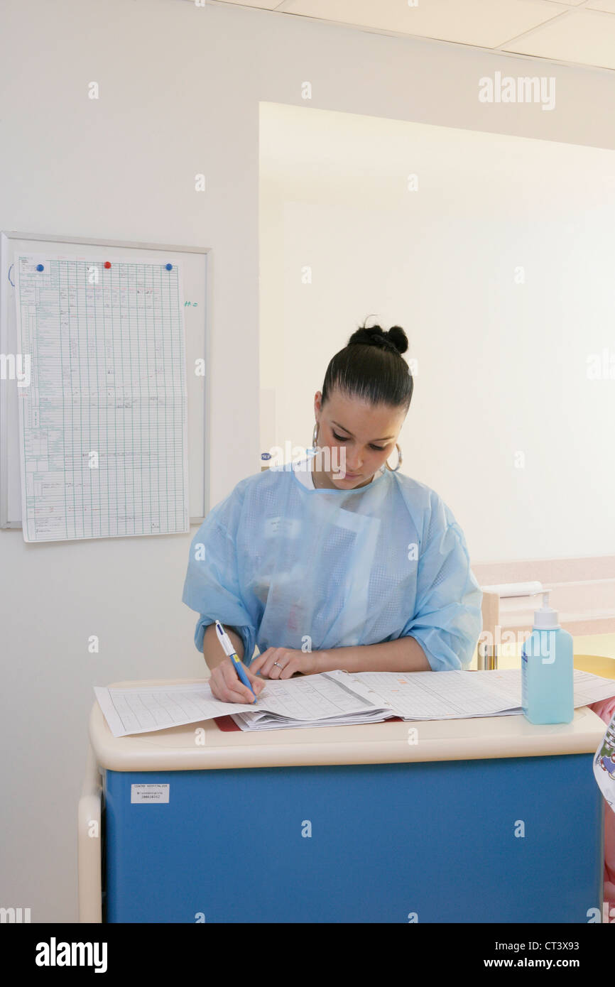 NURSE WITH PATIENT'S RECORD Stock Photo - Alamy