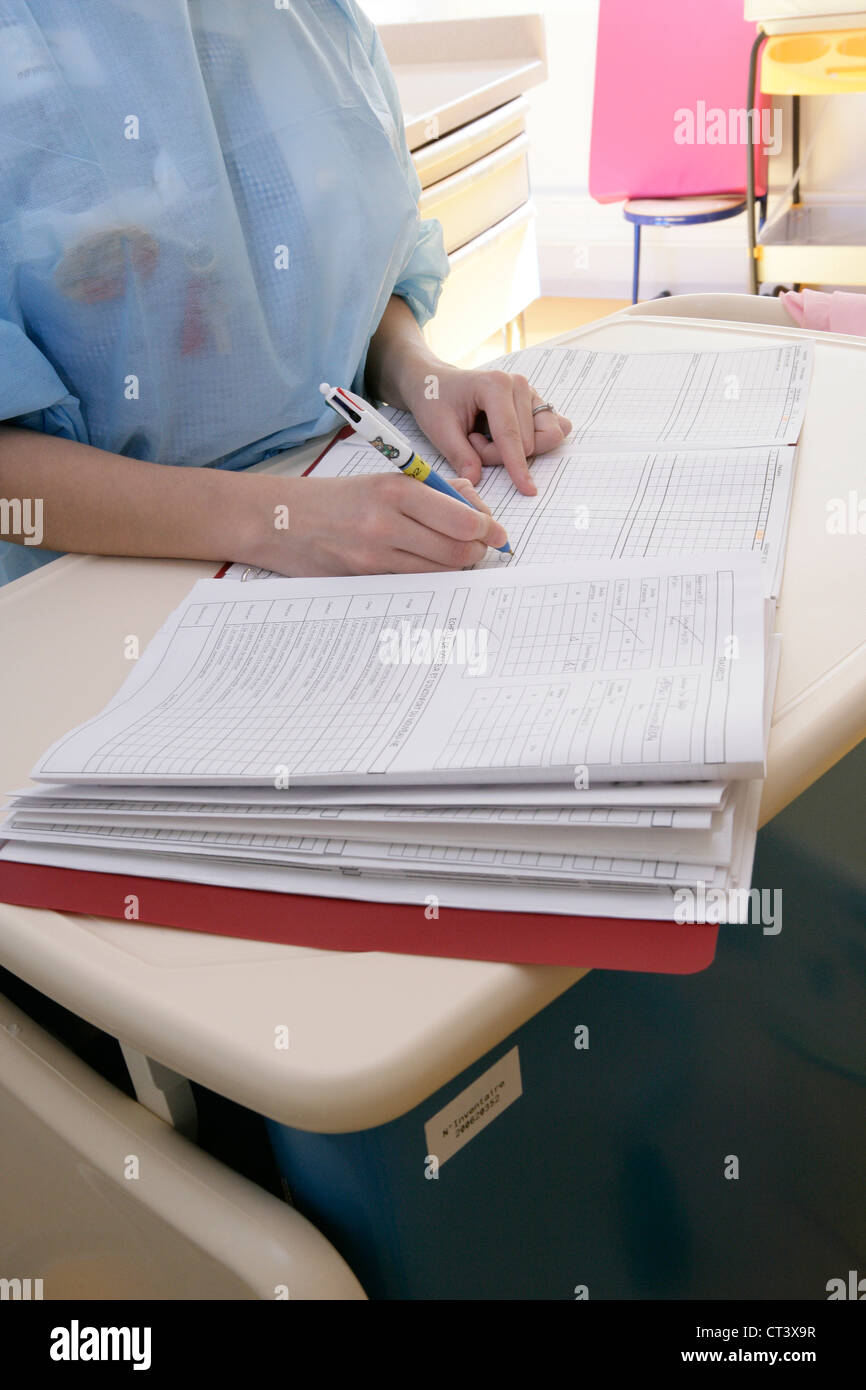 NURSE WITH PATIENT'S RECORD Stock Photo - Alamy