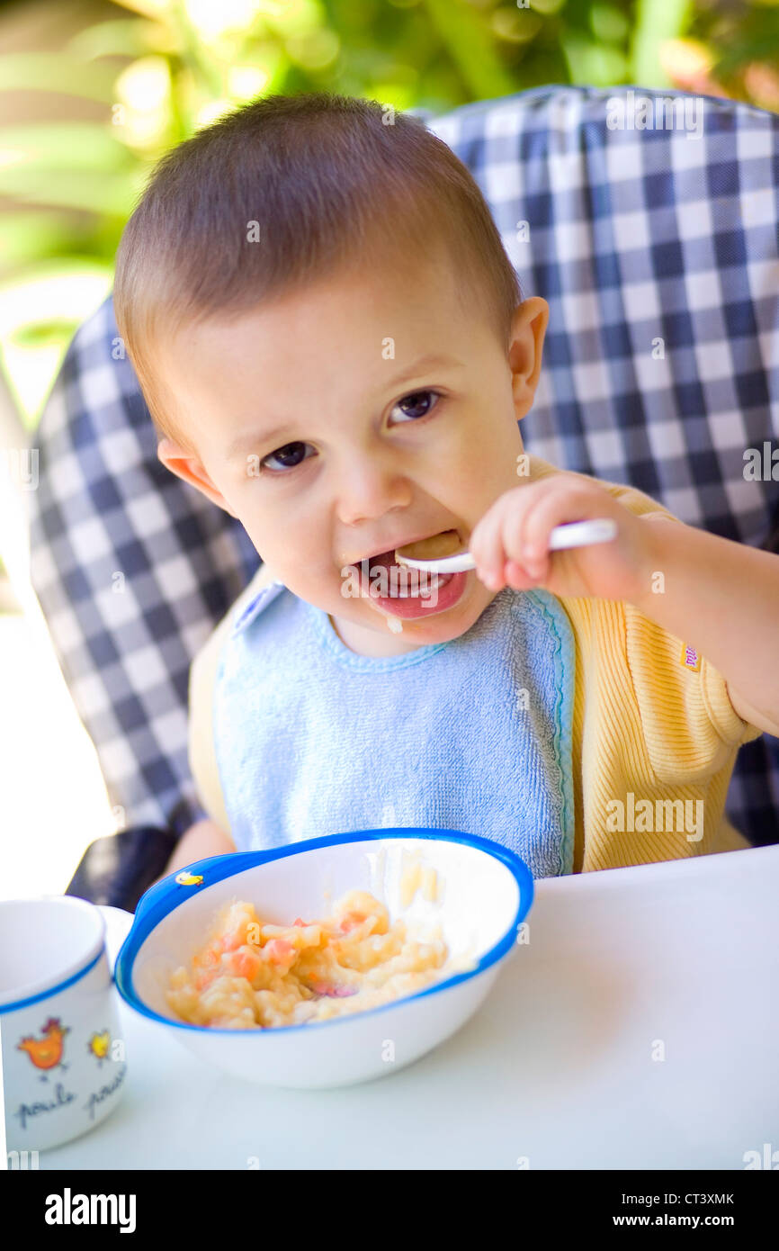 CHILD EATING A MEAL Stock Photo - Alamy
