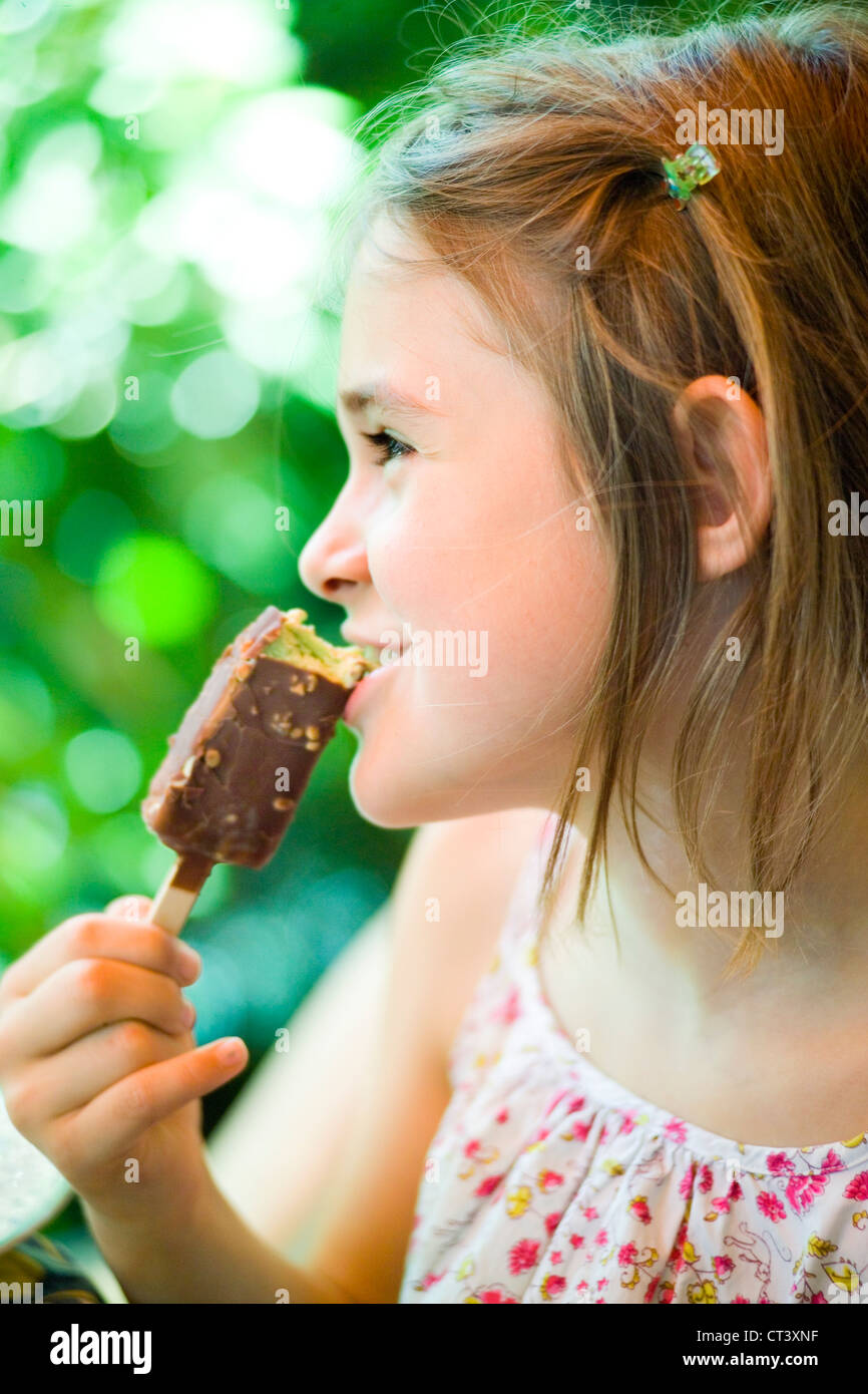 CHILD EATING SWEETS Stock Photo - Alamy