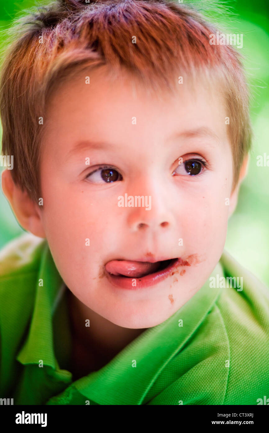 CHILD EATING SWEETS Stock Photo - Alamy