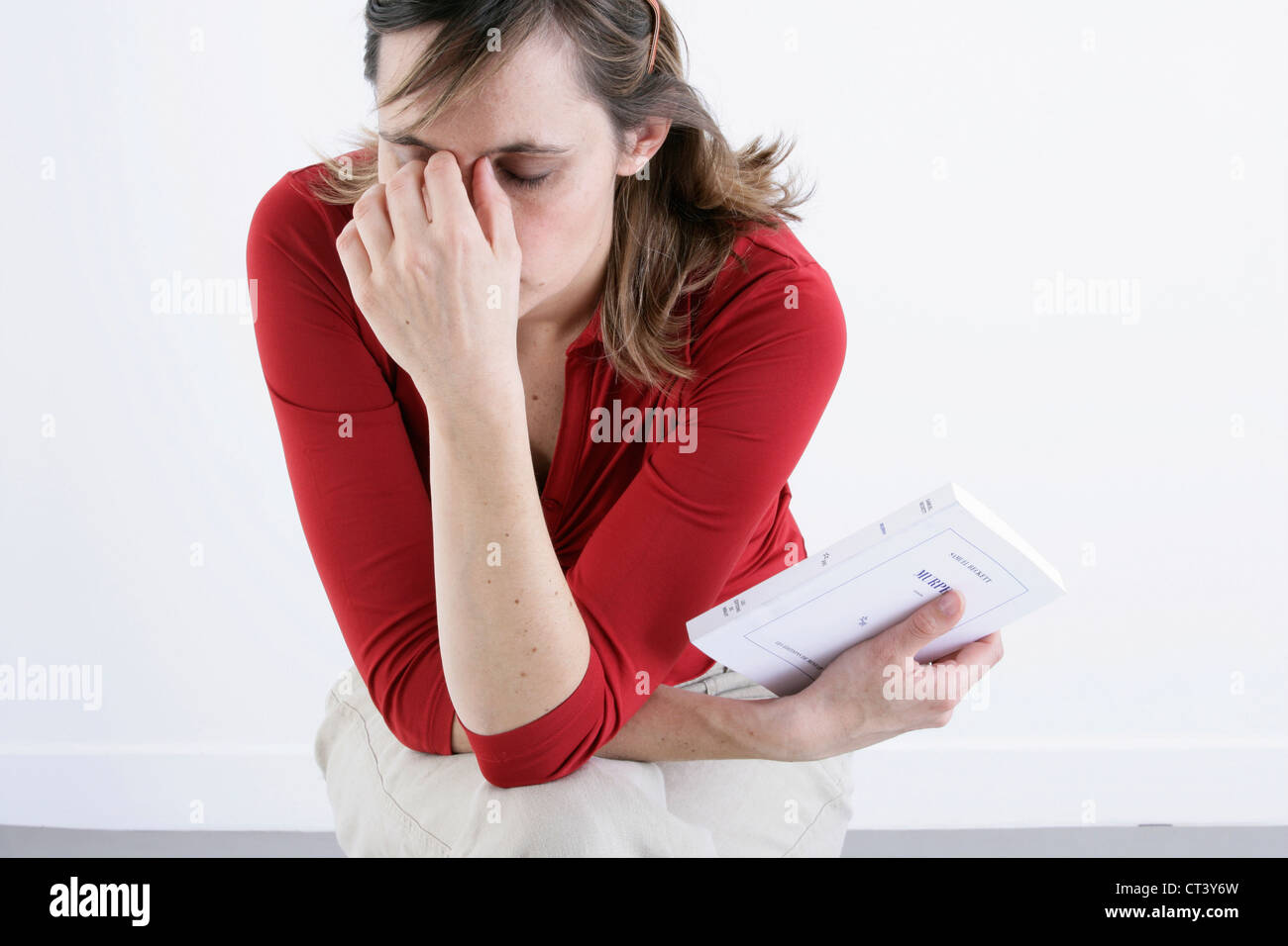 Lady tired reading old hi-res stock photography and images - Alamy