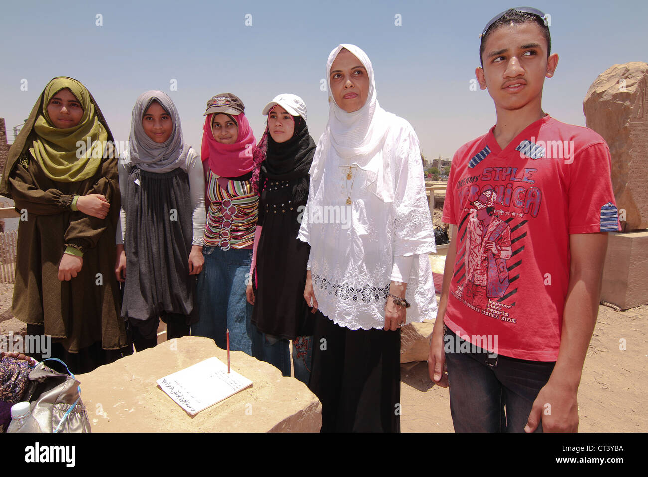 School children from Aswan conduct experiments using pencils to show ...