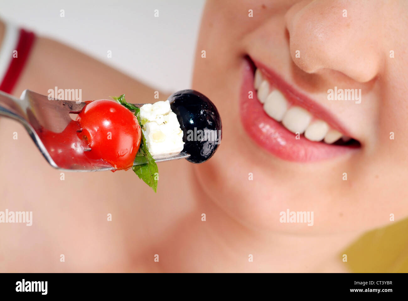 WOMAN EATING RAW VEGETABLES Stock Photo - Alamy