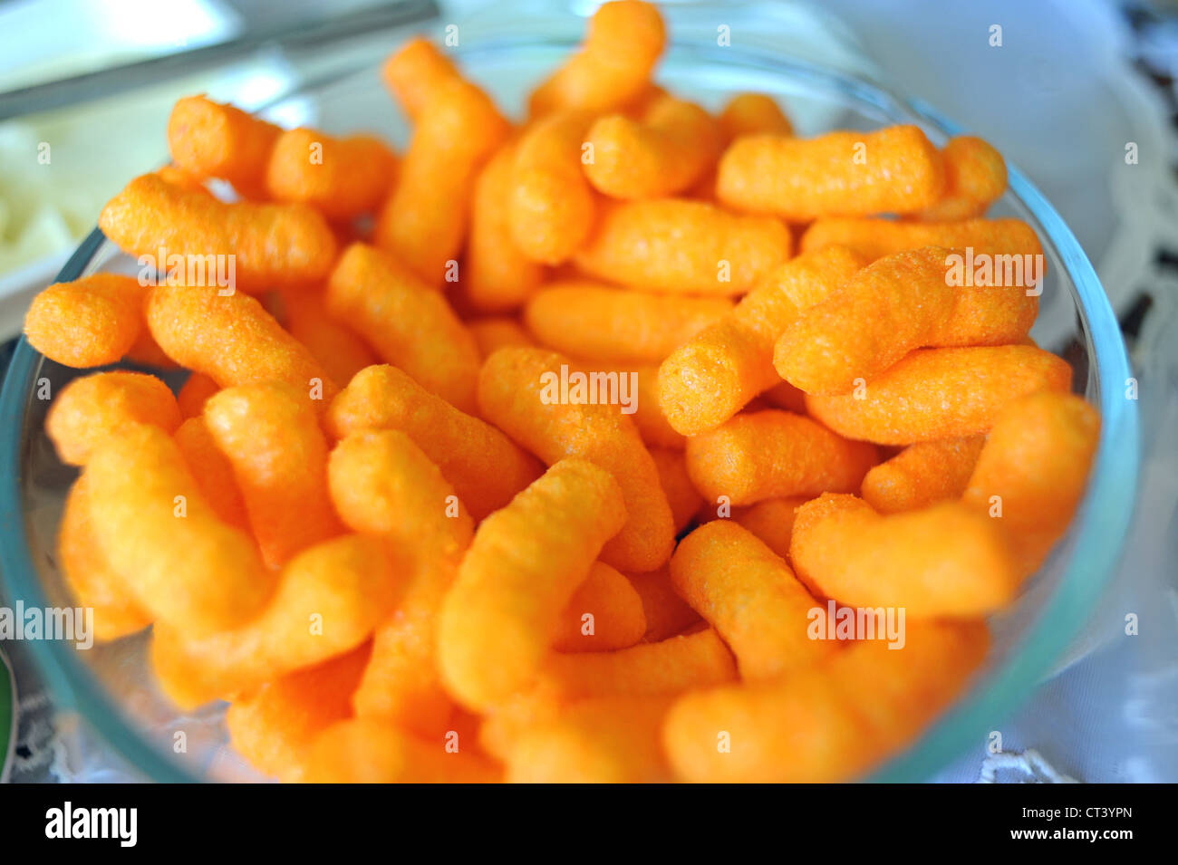 Bright orange coloured cheese wotsit snack food Stock Photo - Alamy