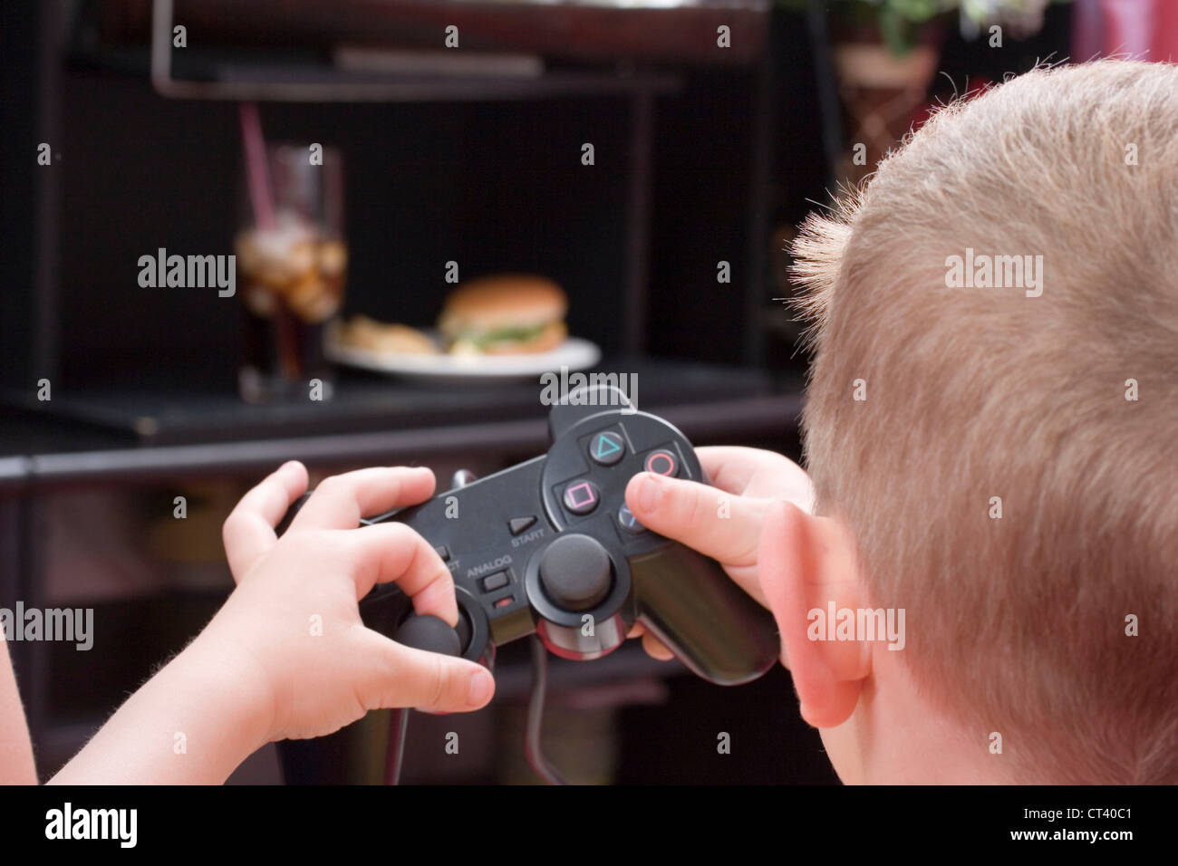 CHILD PLAYING WITH VIDEO GAME Stock Photo - Alamy