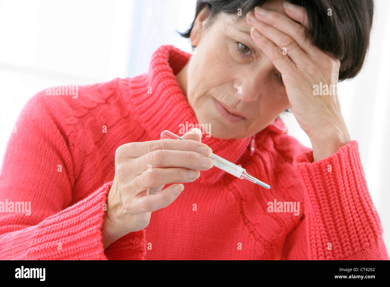 FEVER IN AN ELDERLY PERSON Stock Photo - Alamy
