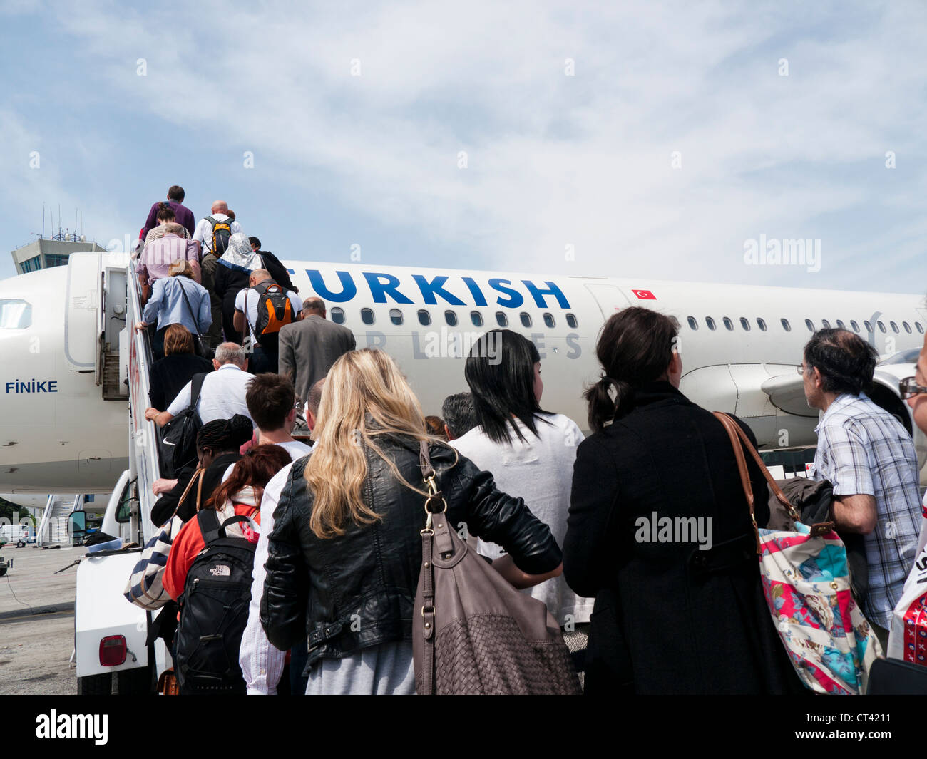 People boarding a Turkish Airlines planes Stock Photo - Alamy
