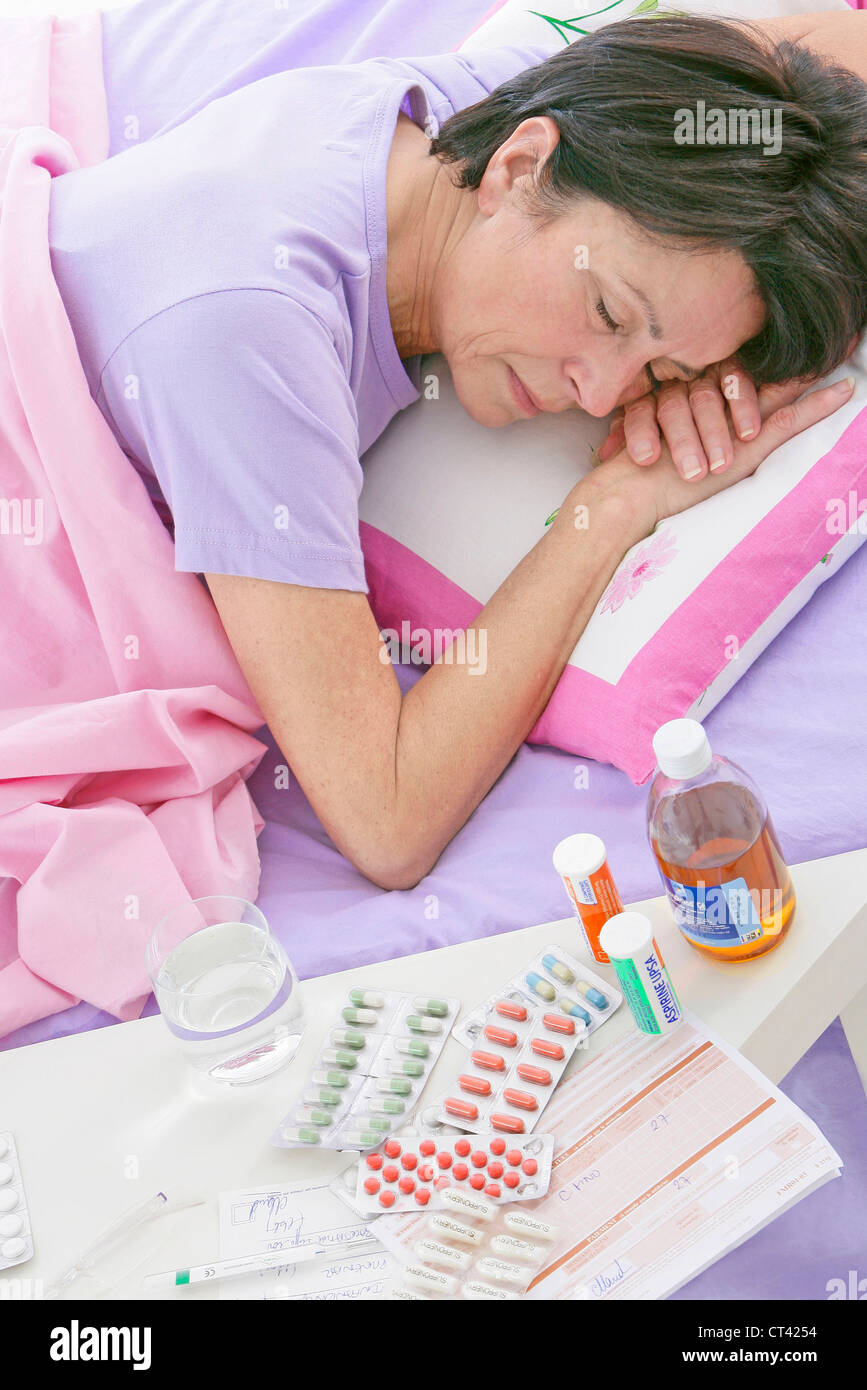 WOMAN TAKING MEDICATION Stock Photo - Alamy