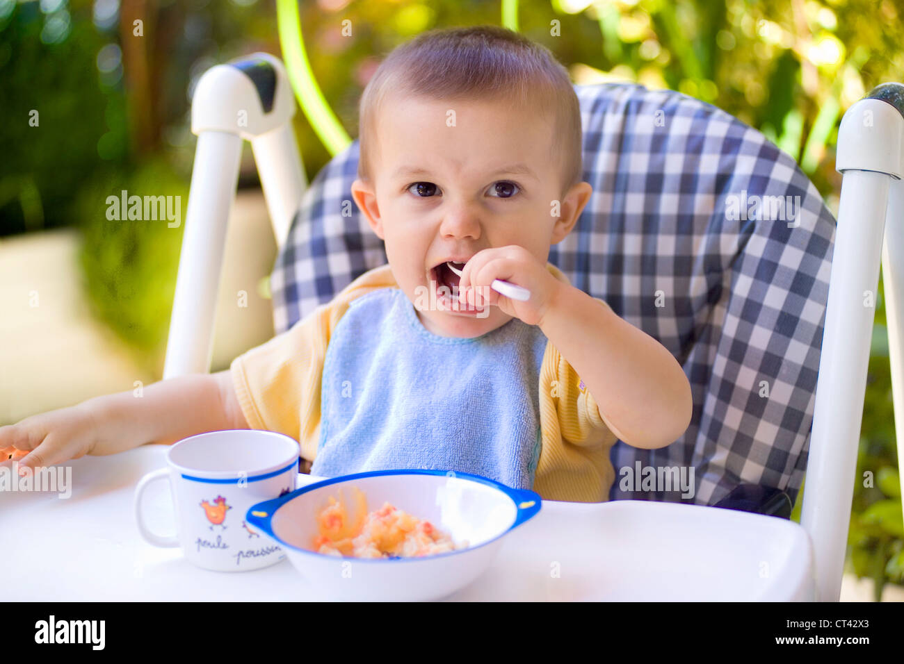 CHILD EATING A MEAL Stock Photo - Alamy