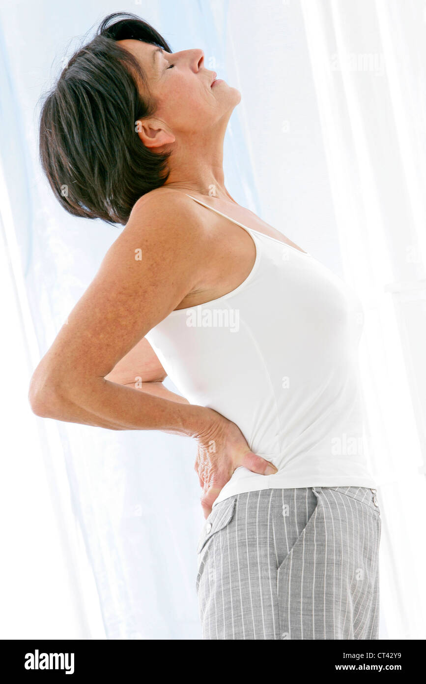 LOWER BACK PAIN IN ELDERLY PERS Stock Photo - Alamy