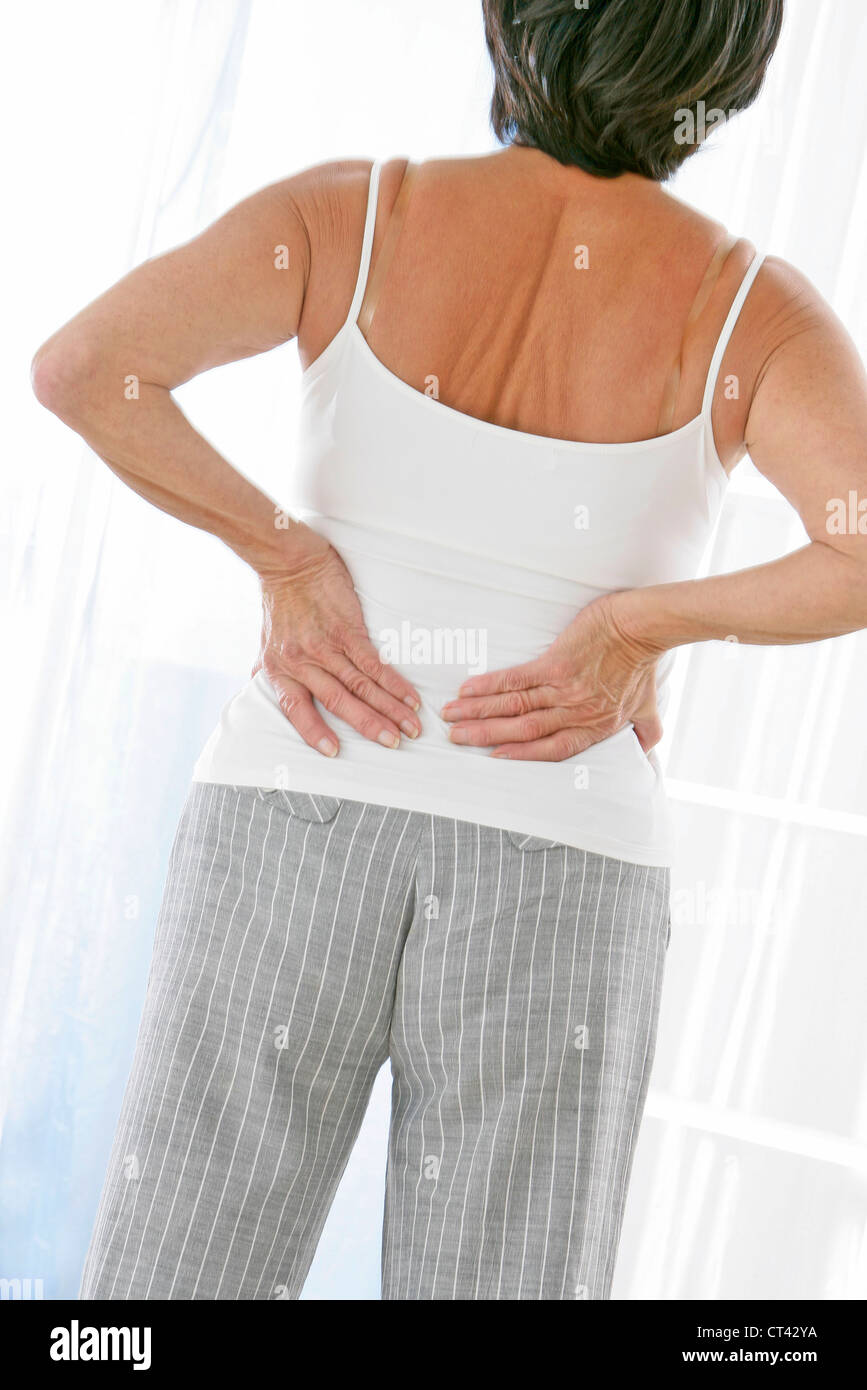 LOWER BACK PAIN IN ELDERLY PERS Stock Photo - Alamy