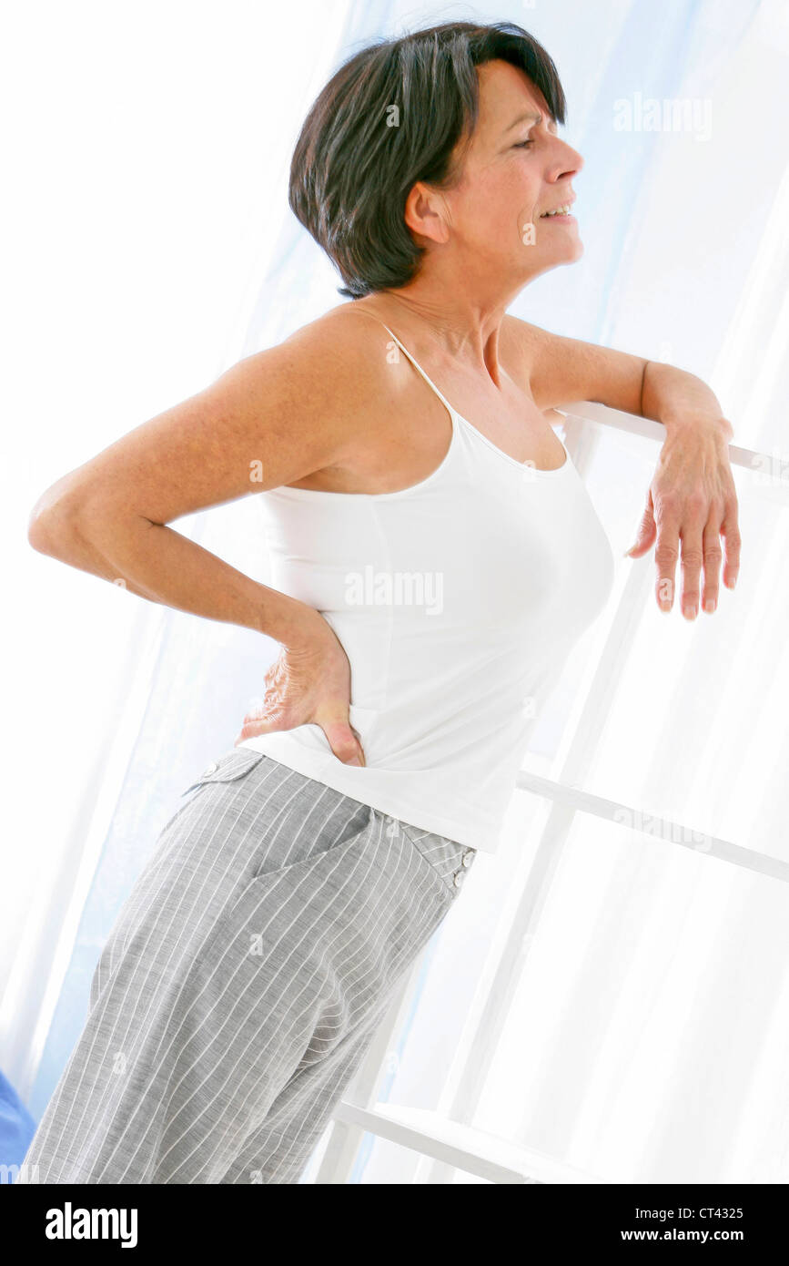 LOWER BACK PAIN IN ELDERLY PERS Stock Photo - Alamy