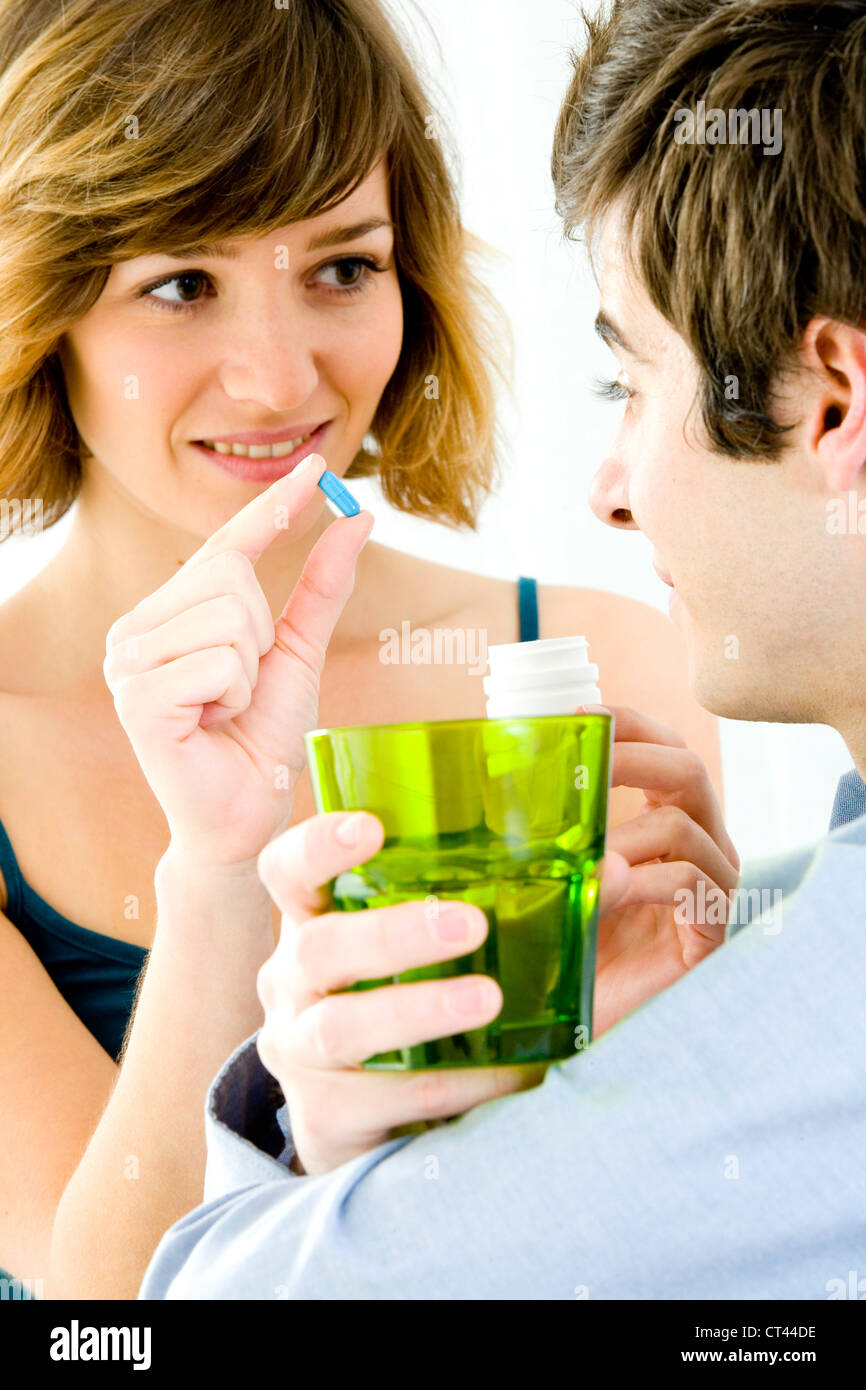 WOMAN TAKING MEDICATION Stock Photo - Alamy