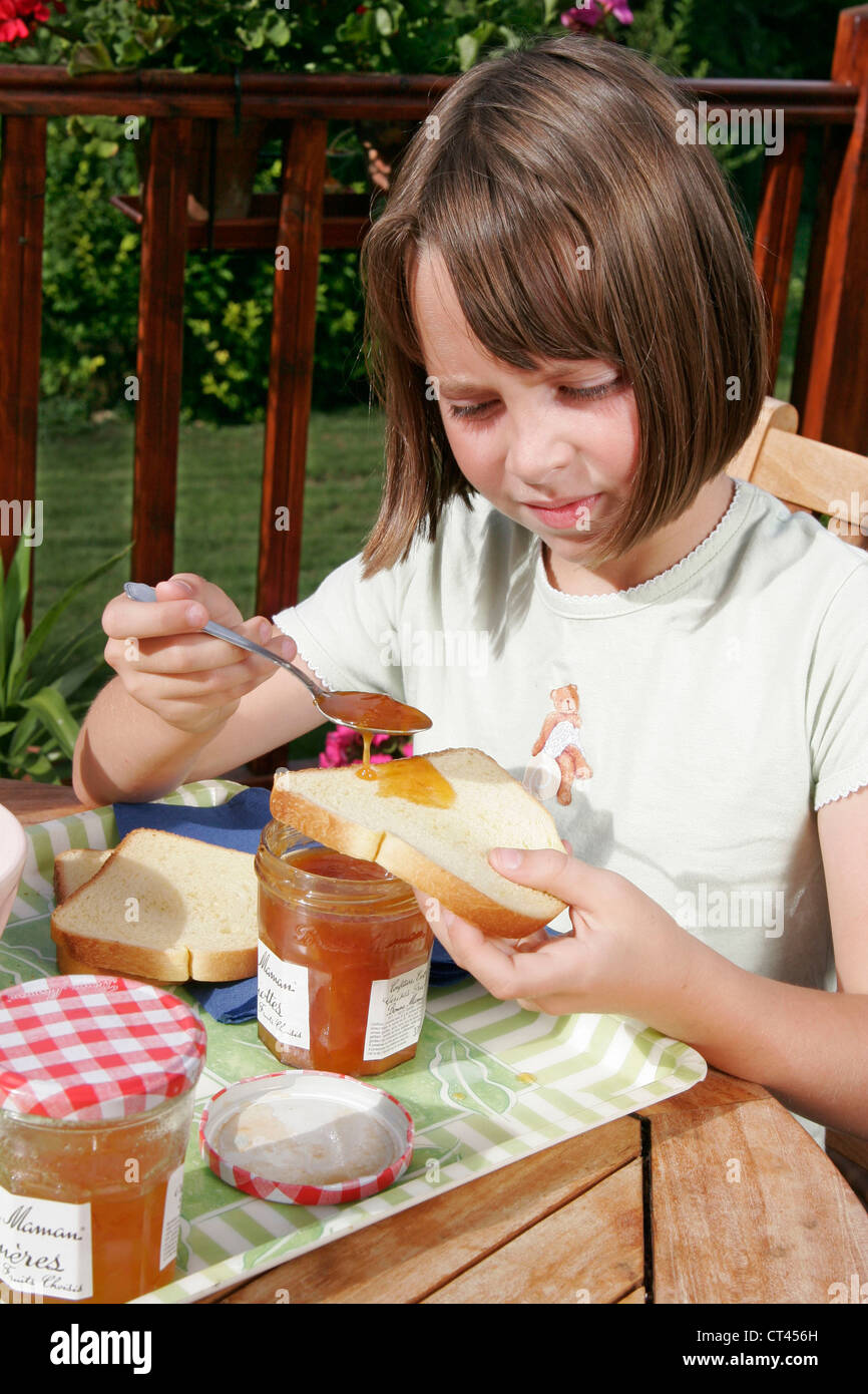 CHILD EATING BREAKFAST Stock Photo - Alamy