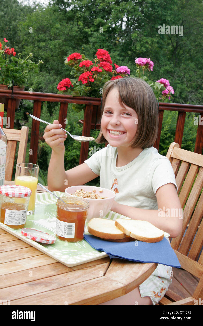 CHILD EATING BREAKFAST Stock Photo - Alamy
