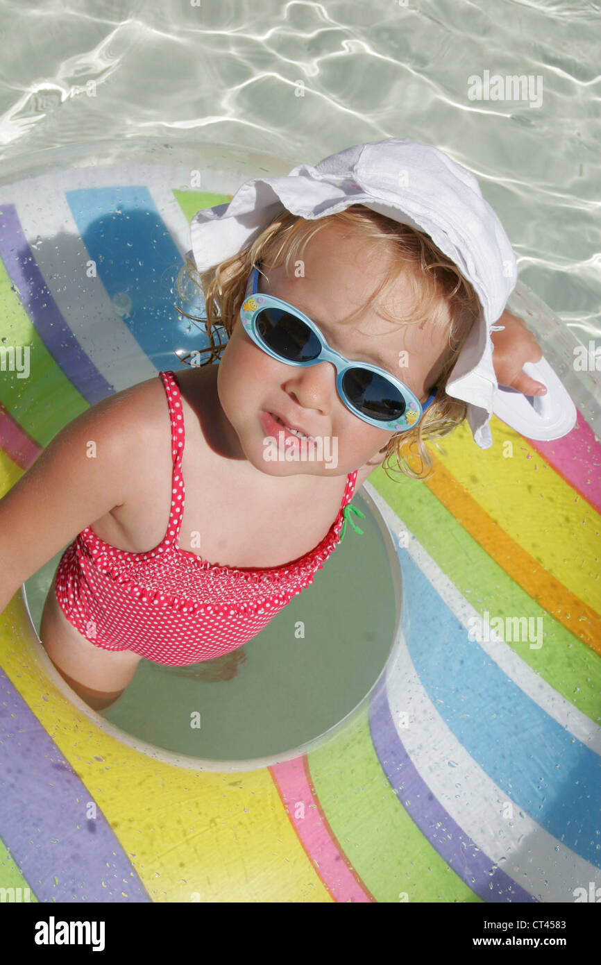 Protected by a sun hat with sunglasses hi-res stock photography and ...