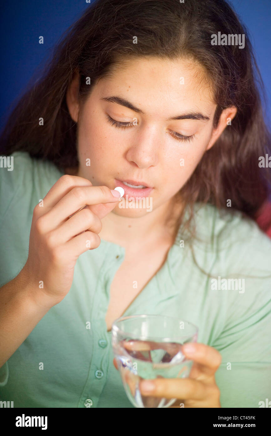 ADOLESCENT TAKING MEDICATION Stock Photo - Alamy