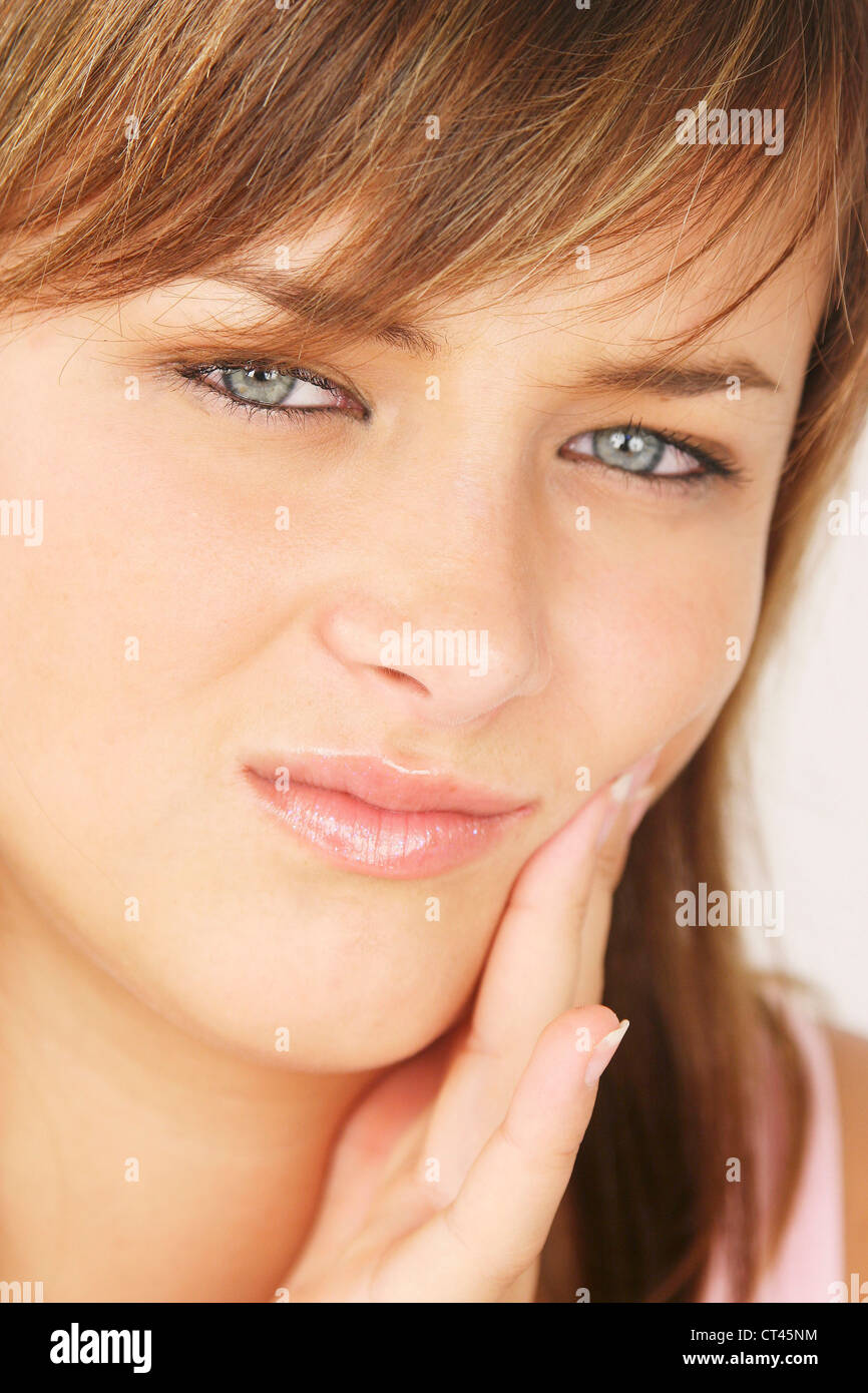 PAINFUL TOOTH IN A WOMAN Stock Photo - Alamy