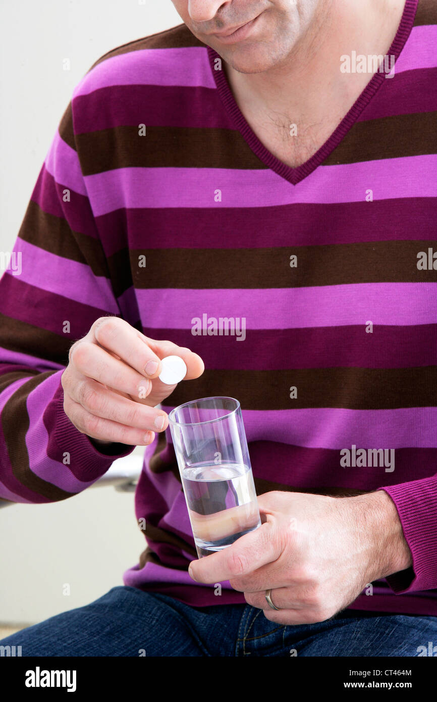 MAN TAKING MEDICATION Stock Photo - Alamy