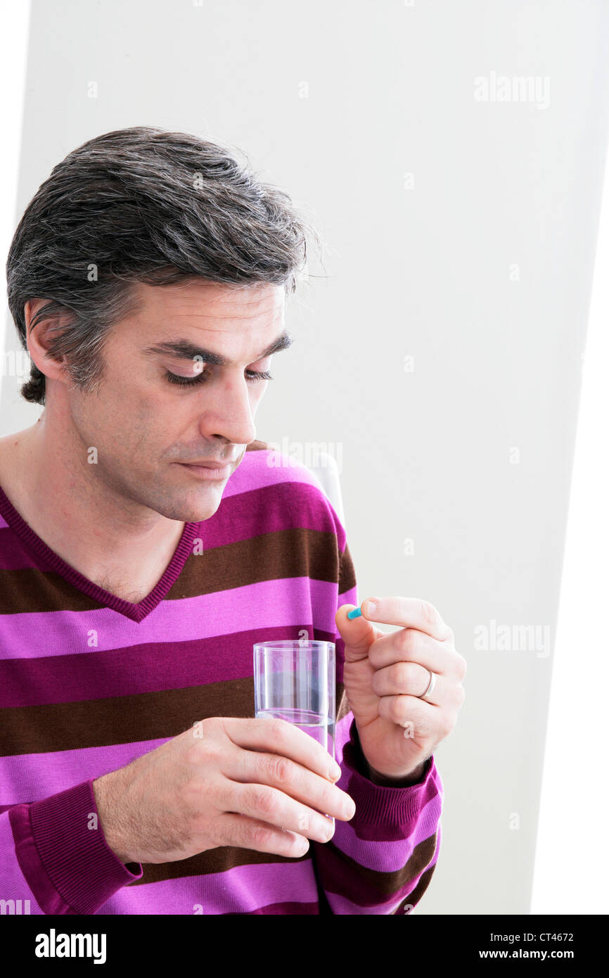 MAN TAKING MEDICATION Stock Photo - Alamy