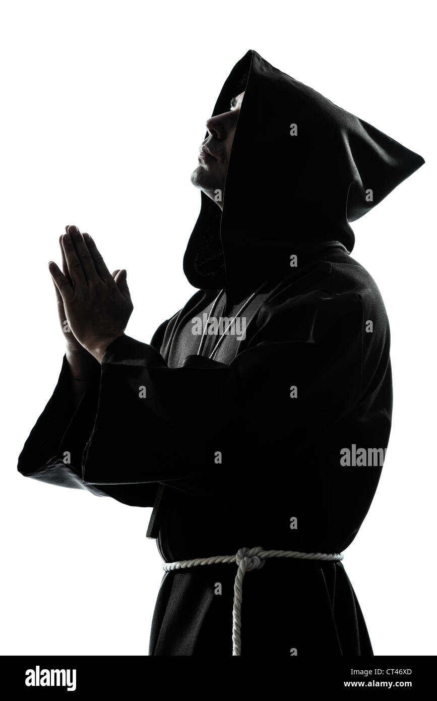 one caucasian man priest praying silhouette in studio isolated on white ...