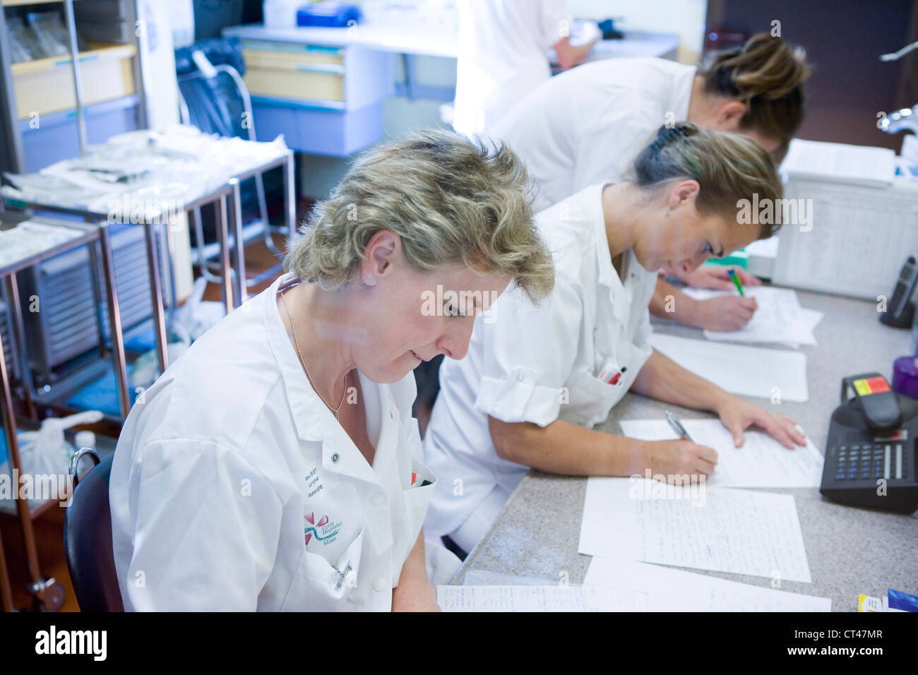 NURSE WITH PATIENT'S RECORD Stock Photo - Alamy