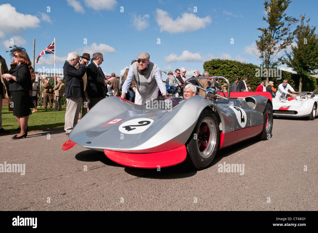 Classic racing cars being pushed to the starting grid, Goodwood Revival ...