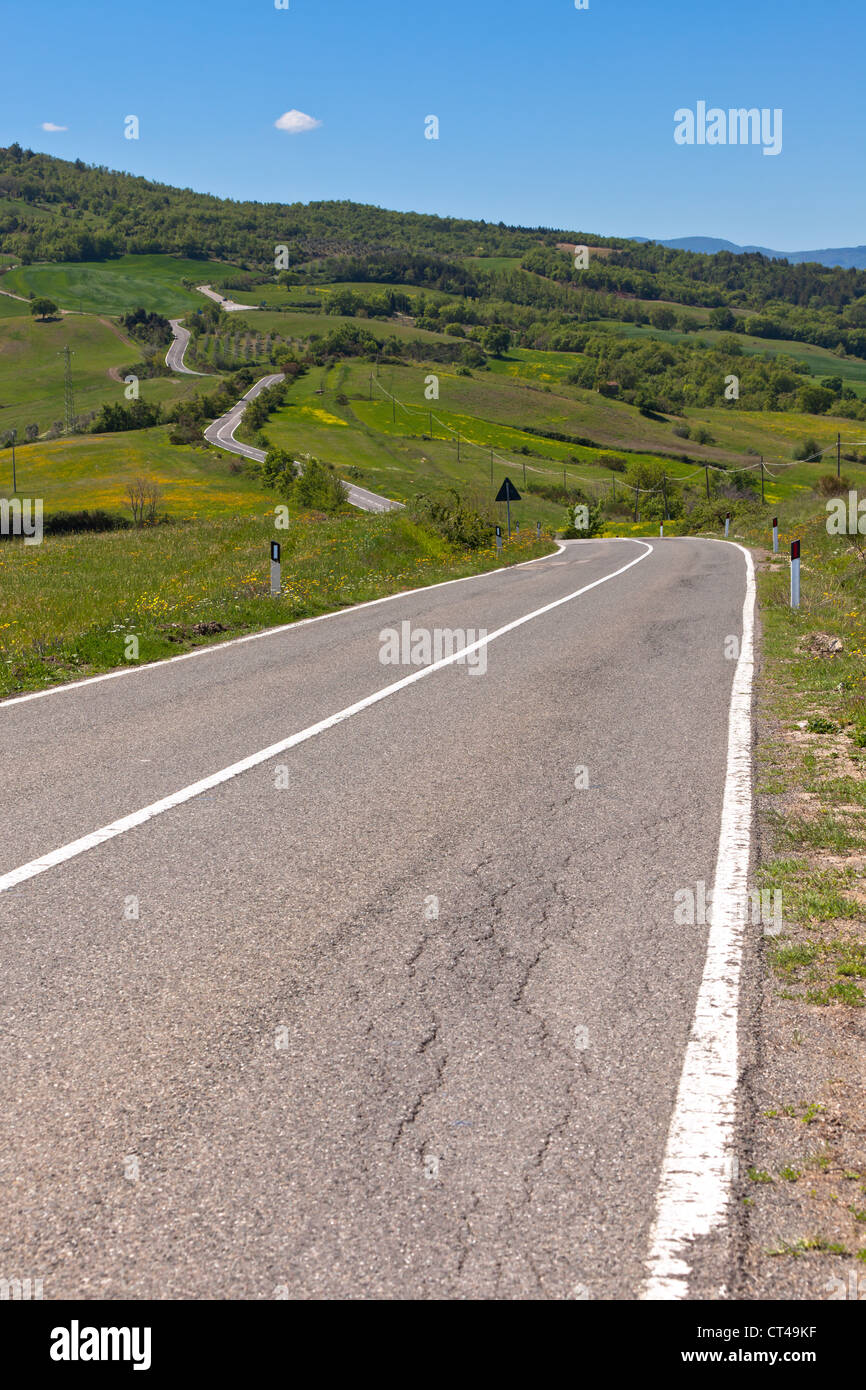 Outdoor green Tuscan view with local curve road. Vertical shot Stock ...