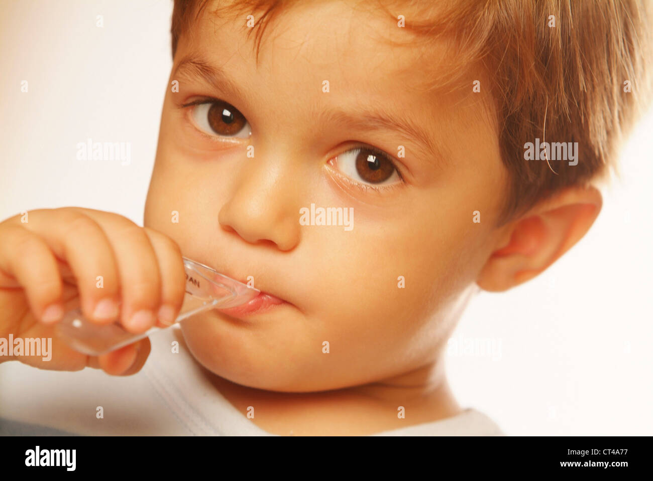 CHILD TAKING MEDICATION Stock Photo - Alamy