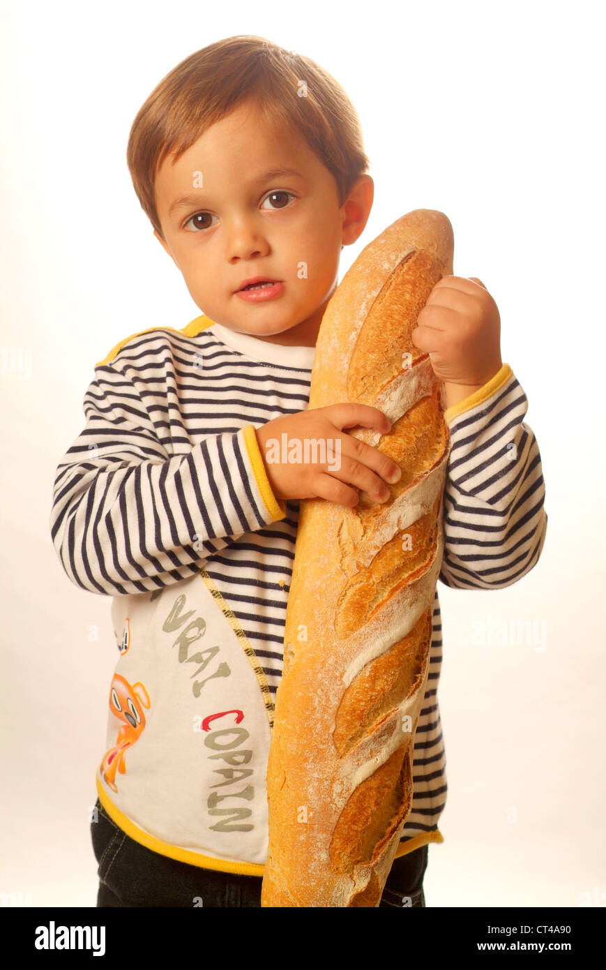 CHILD EATING STARCHY FOOD Stock Photo - Alamy