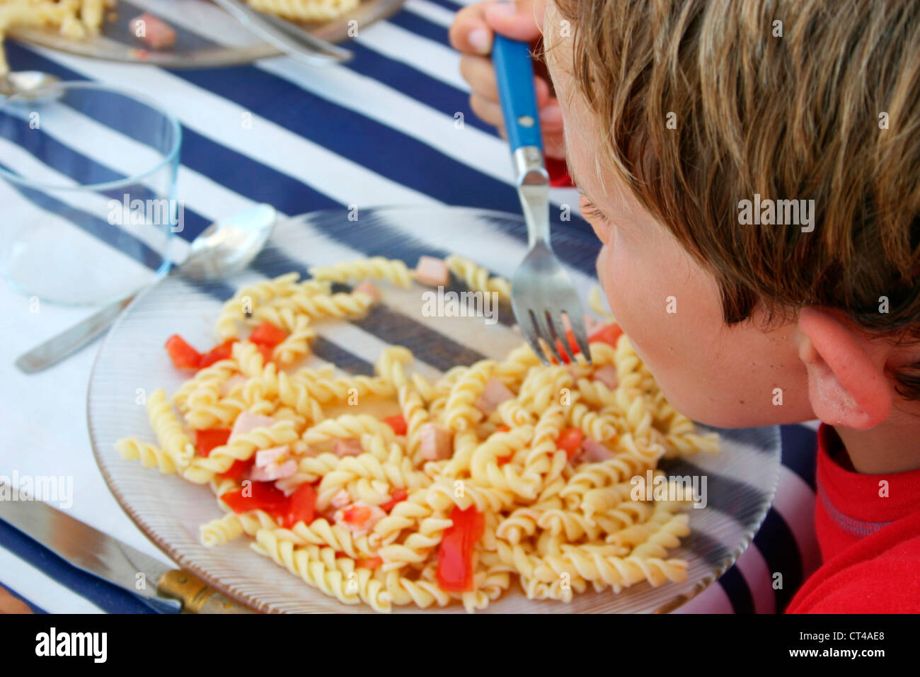 CHILD EATING STARCHY FOOD Stock Photo - Alamy