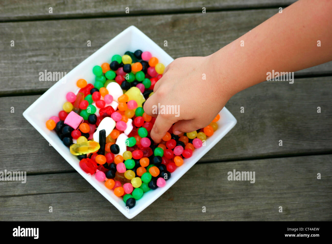 CHILD EATING SWEETS Stock Photo - Alamy